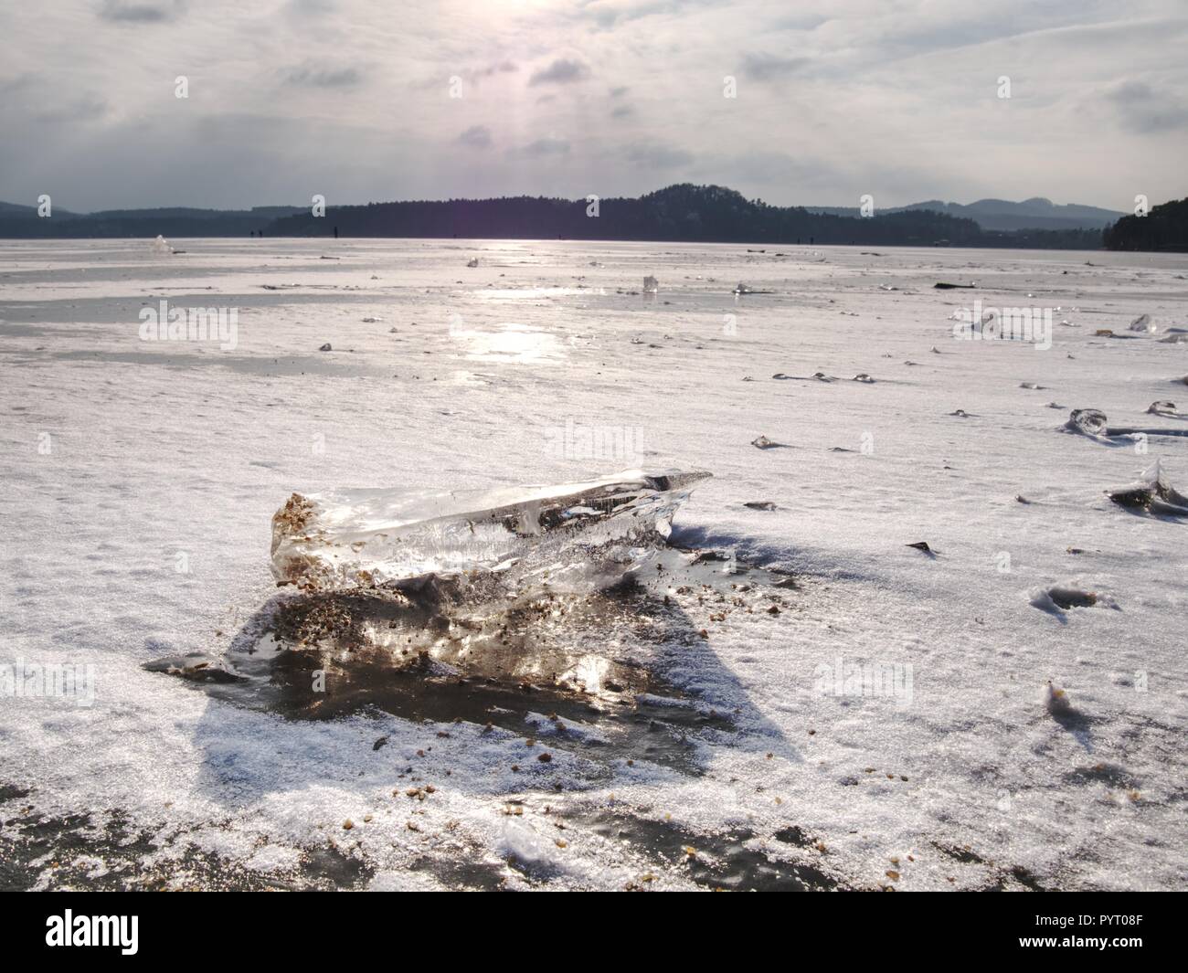 Ice breaking. Floe on frozen lake with sunset sky background Stock ...