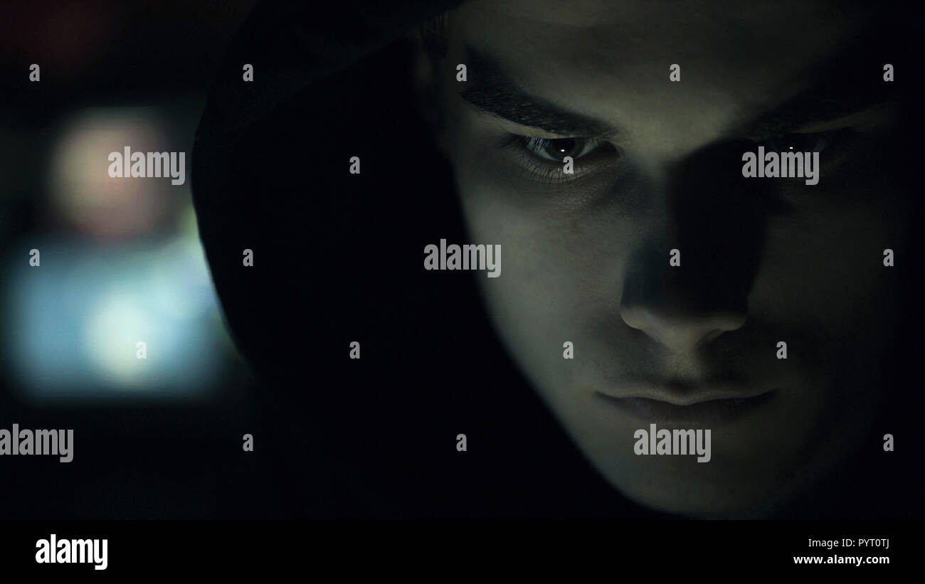 Cool young hacker with hoodie posing in the dark, cyber security and ...