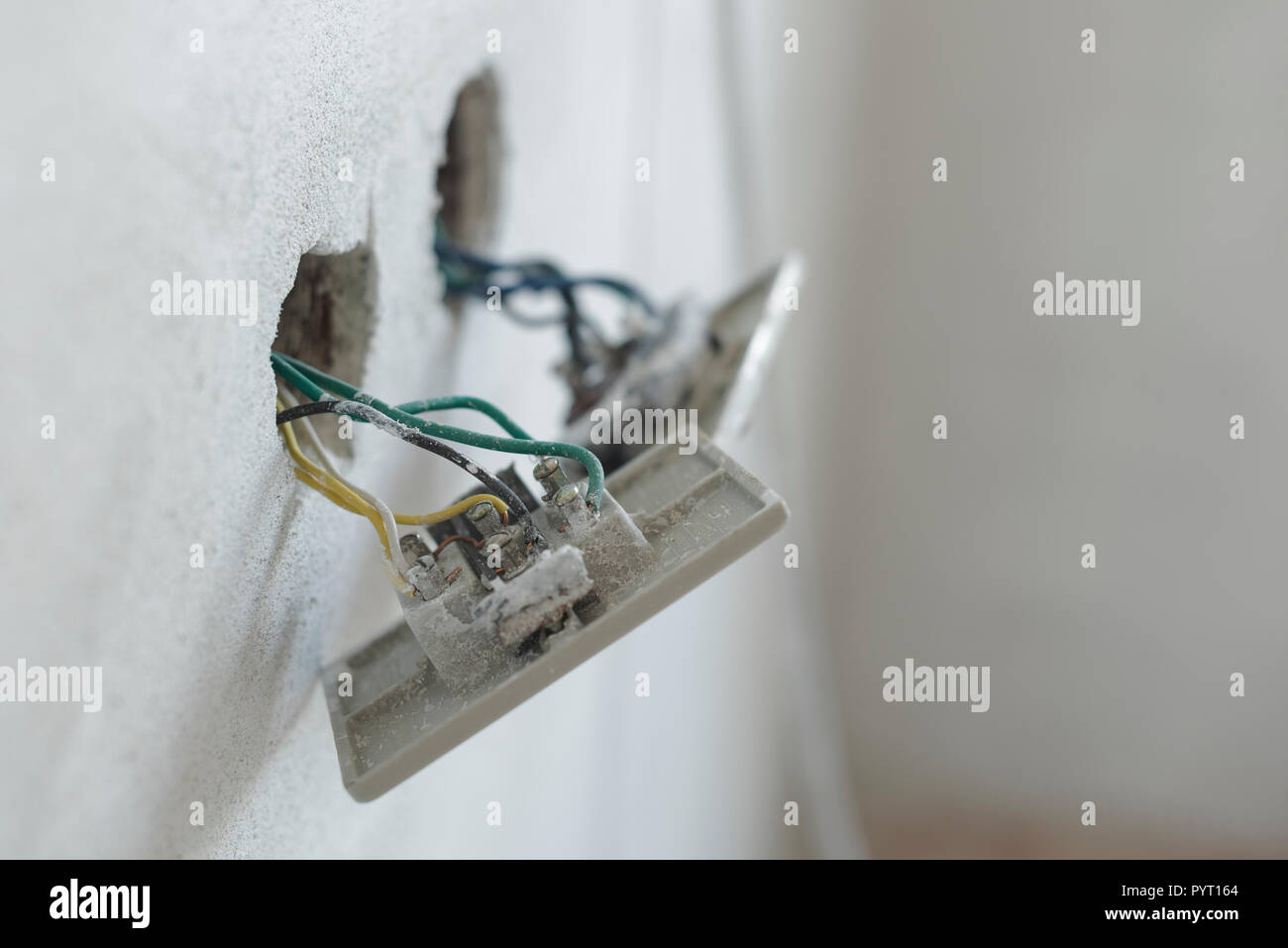 Wall socket installation and renovation, close up of old socket and ...