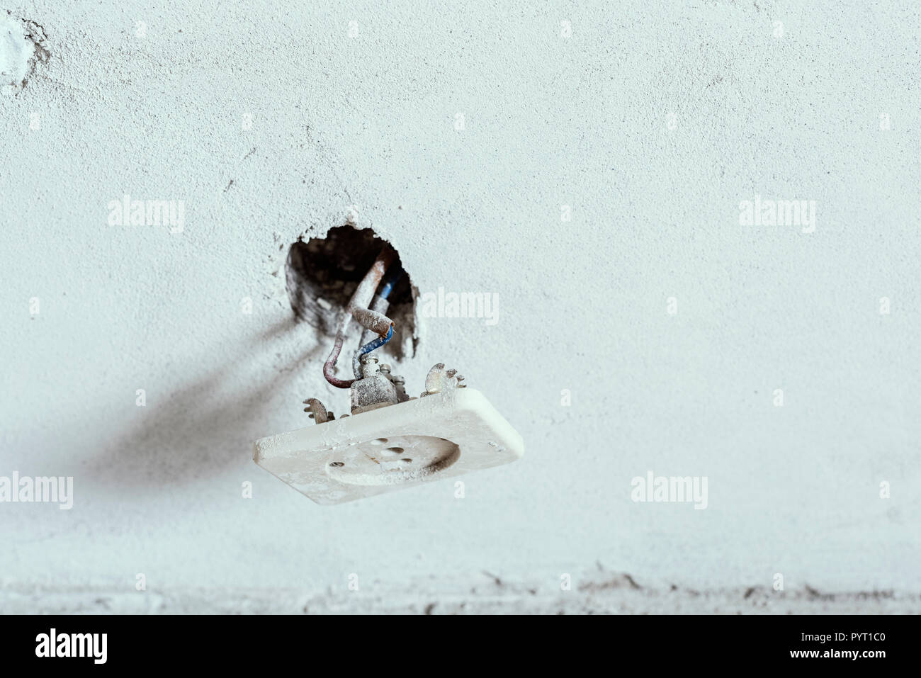 Wall socket installation and renovation, close up of old socket and ...