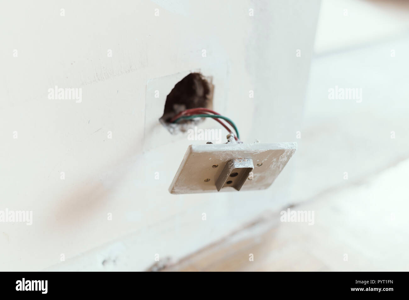 Wall socket installation and renovation, close up of old socket and ...