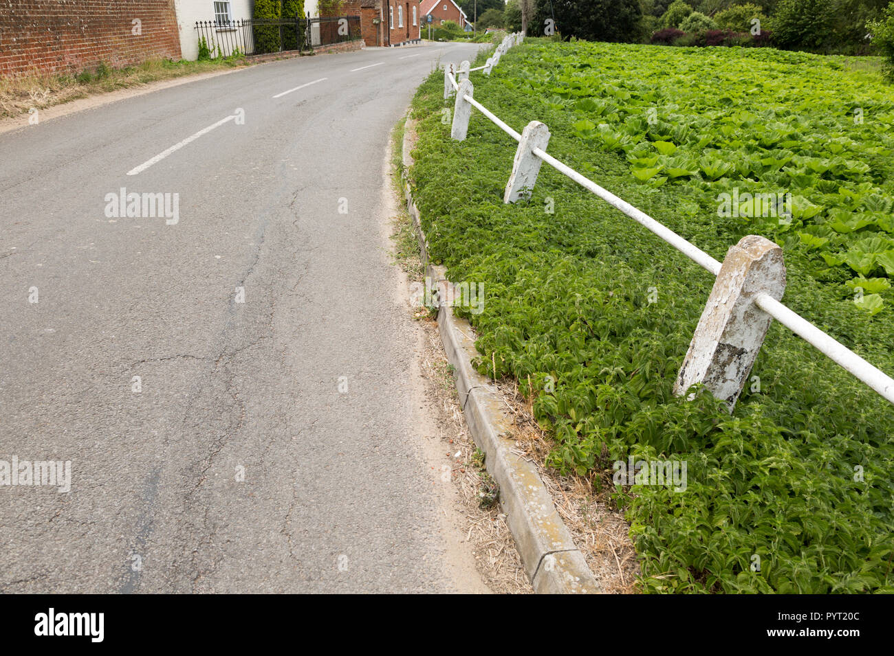 Cracks appearing tarmac road surface due to mass movement, Shottisham ...