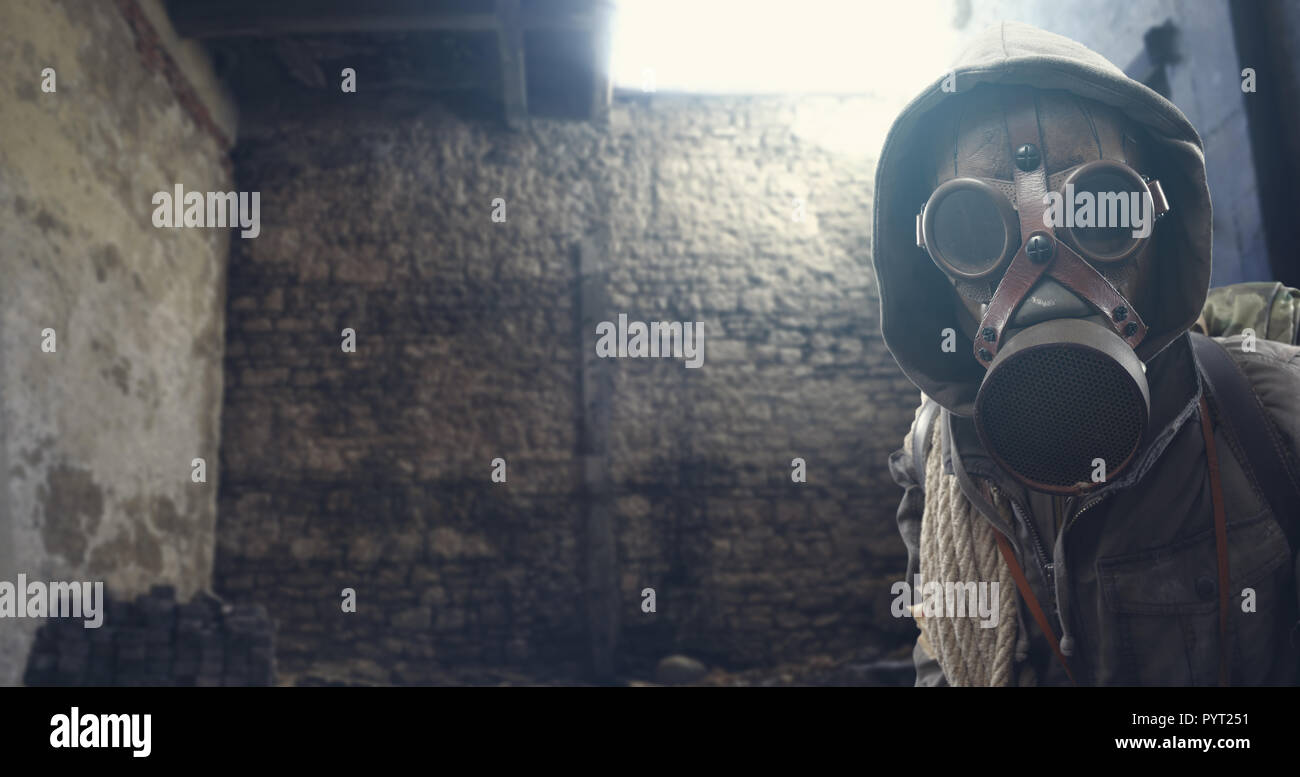 Nuclear disaster survivor in a post apocalyptic setting, he is wearing ...