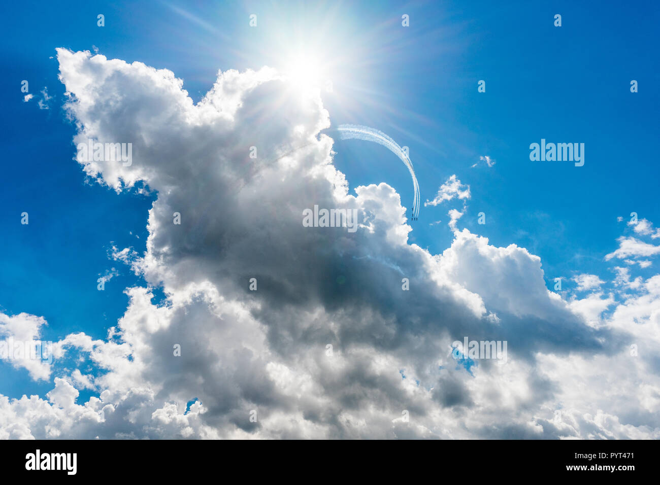 Airplanes perform shapes in the sky on sunny day Stock Photo - Alamy