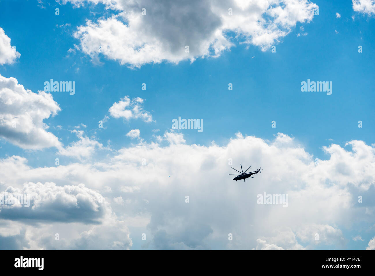 Military Helicopter flying high in the sky Stock Photo - Alamy