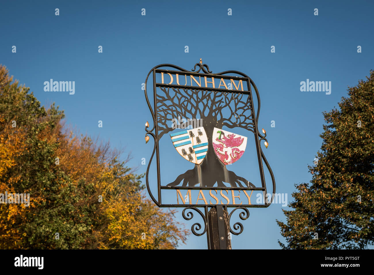 Dunham Massey village sign in sunshine Stock Photo - Alamy