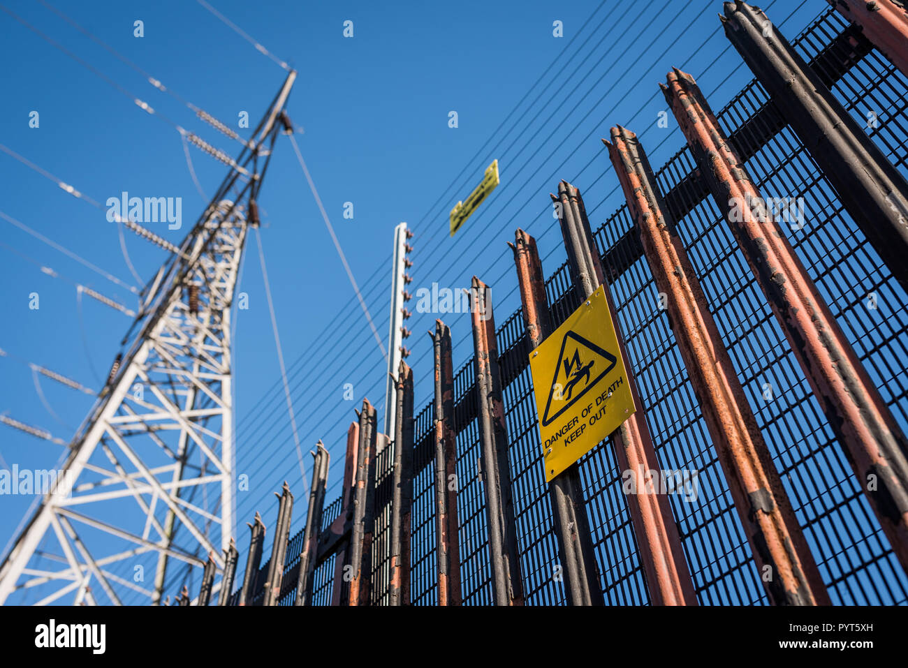 Warning sign on electricity pylon hi-res stock photography and images ...
