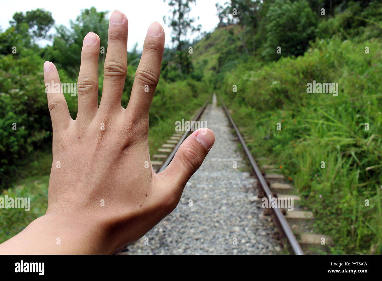 A hand tries to stop the train coming. Taken in Sri Lanka, August 2018 ...