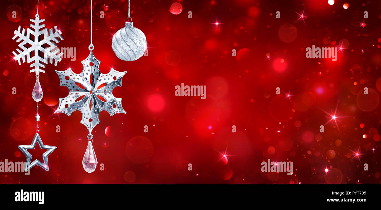 Silver Baubles Hanging In Red Shiny Background Stock Photo - Alamy