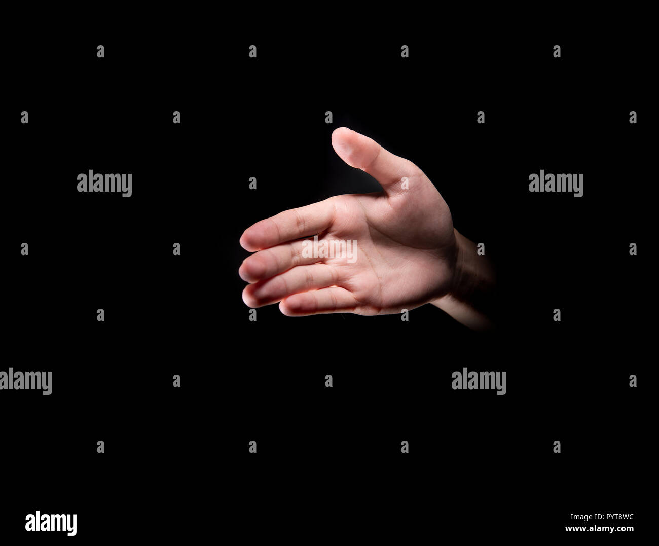 Male hands with open palm offer to handshake over dark background Stock ...