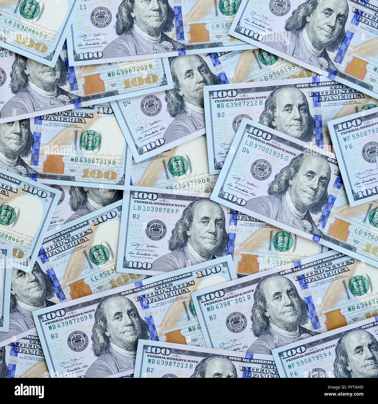 A large number of US dollar bills of a new design with a blue stripe in ...