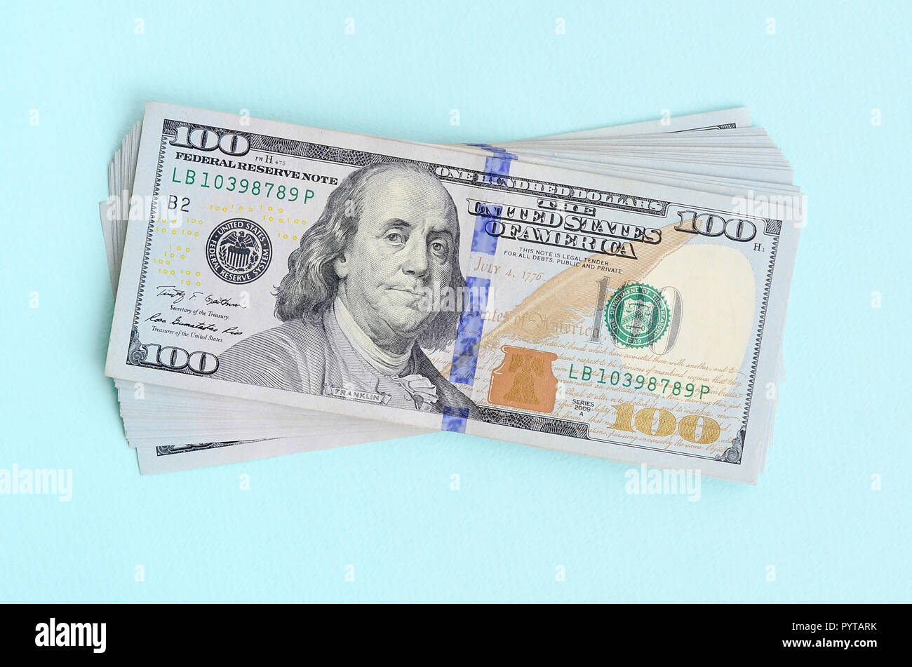 US dollar bills of a new design with a blue stripe in the middle is ...
