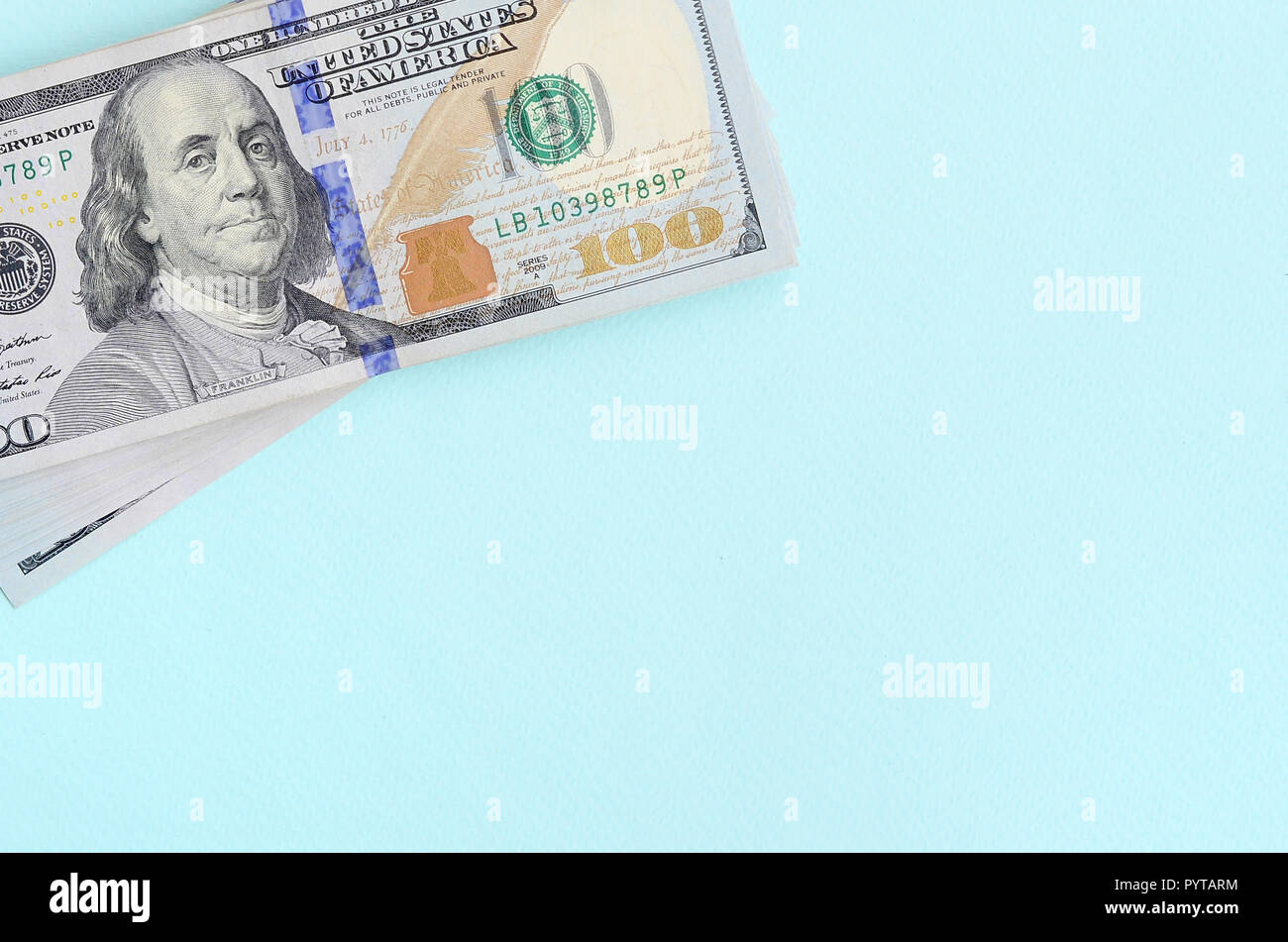 US dollar bills of a new design with a blue stripe in the middle is ...