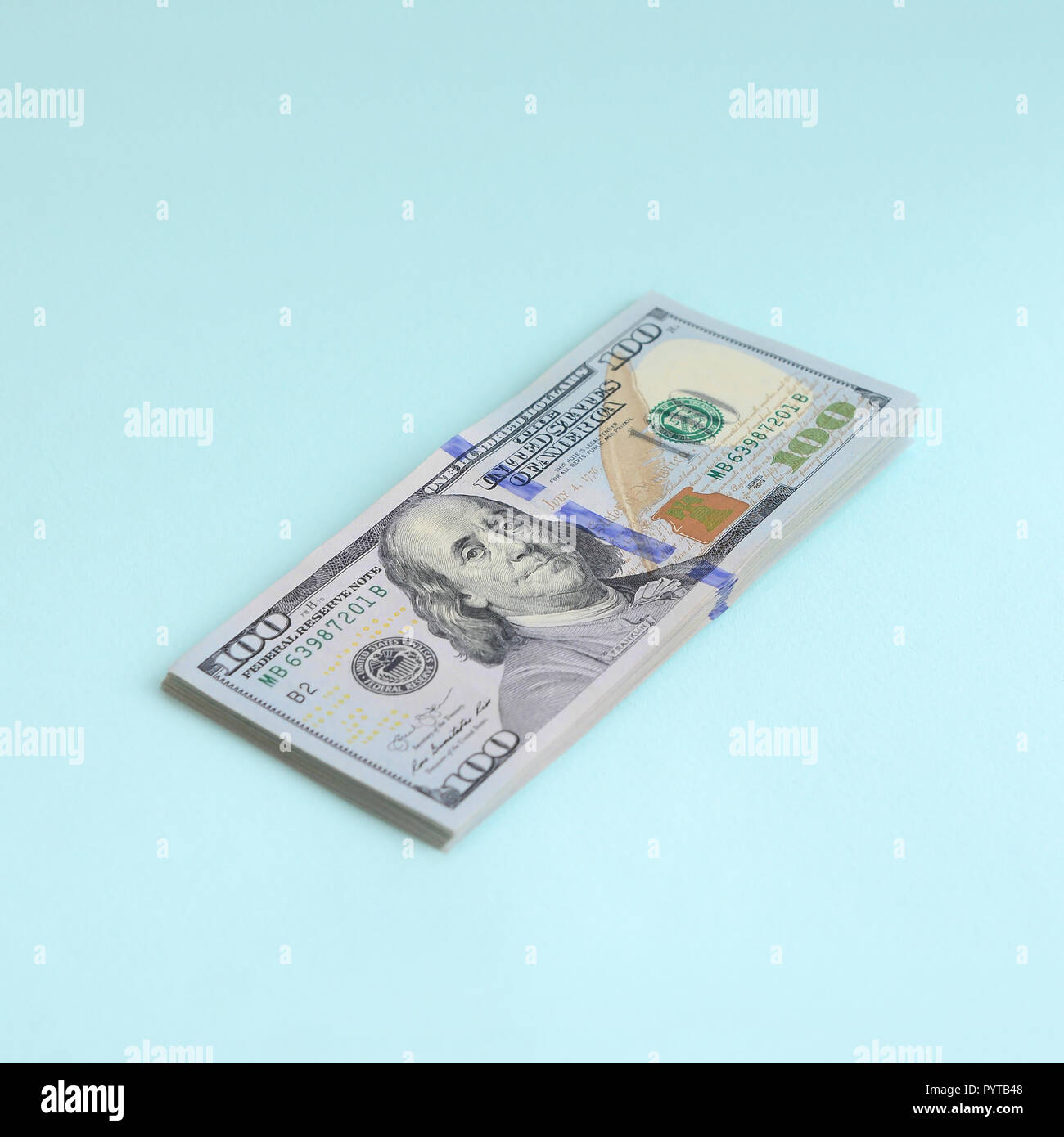 US dollar bills of a new design with a blue stripe in the middle is ...