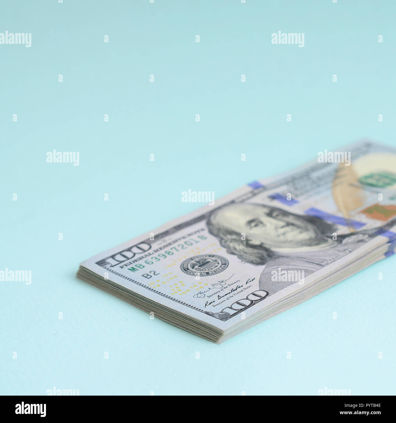 US dollar bills of a new design with a blue stripe in the middle is ...