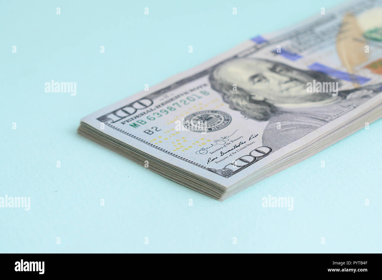 US dollar bills of a new design with a blue stripe in the middle is ...