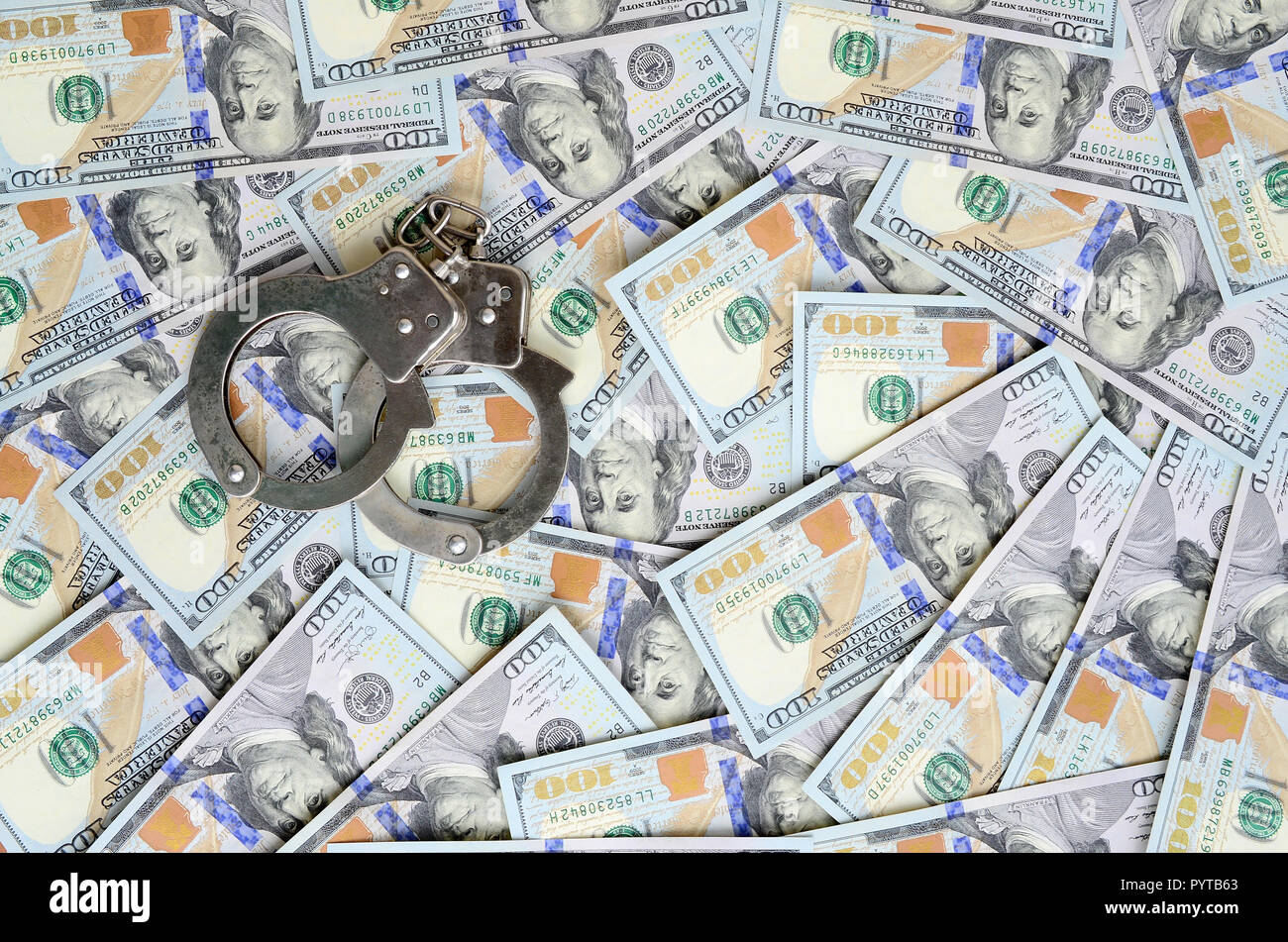 Police handcuffs dollar bills hi-res stock photography and images - Alamy