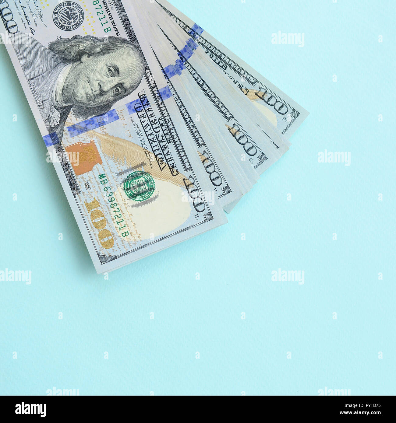 US dollar bills of a new design with a blue stripe in the middle is ...