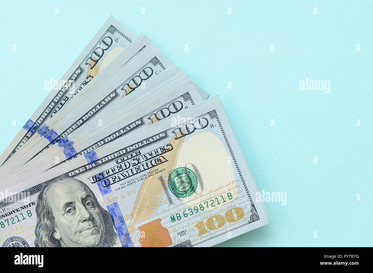 US dollar bills of a new design with a blue stripe in the middle is ...