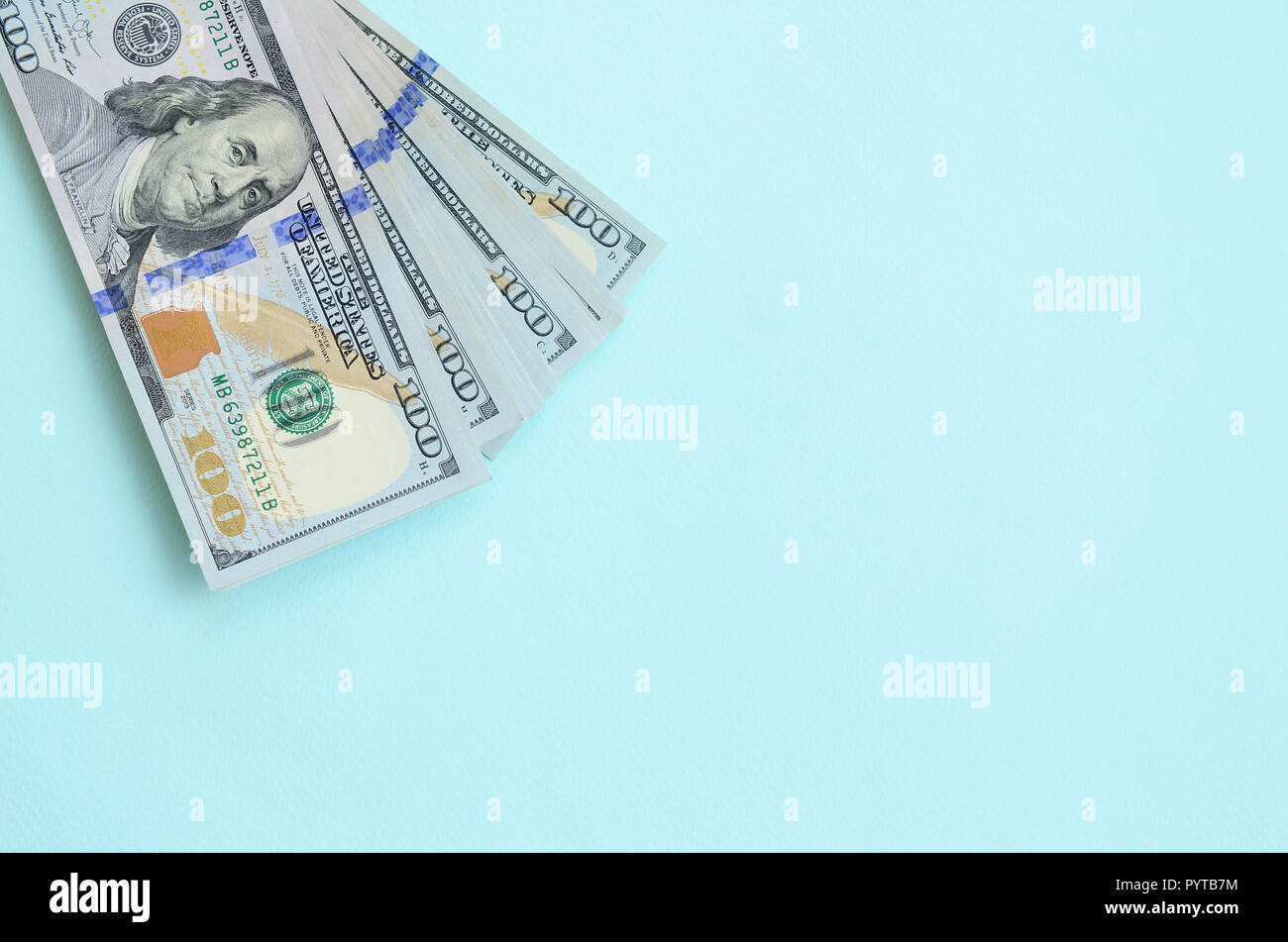 US dollar bills of a new design with a blue stripe in the middle is ...