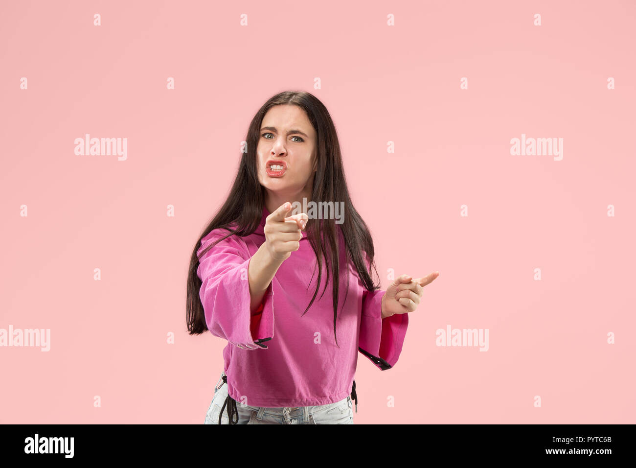 Angry woman looking at camera. Aggressive business woman standing ...