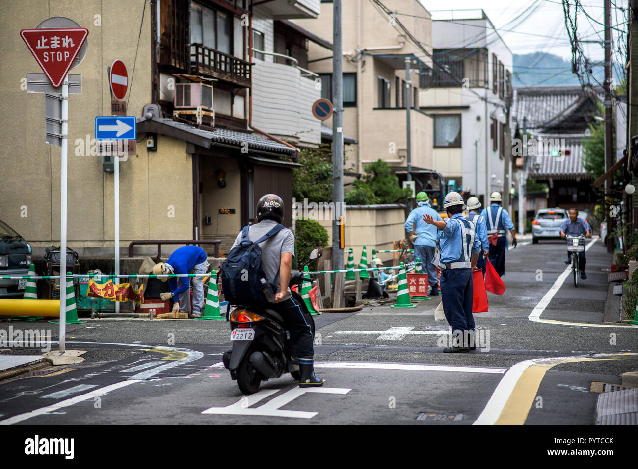 Japanese police is directing traffic on a junction Stock Photo - Alamy