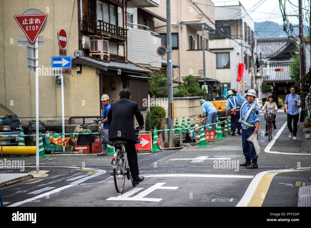 Japanese police is directing traffic on a junction Stock Photo - Alamy