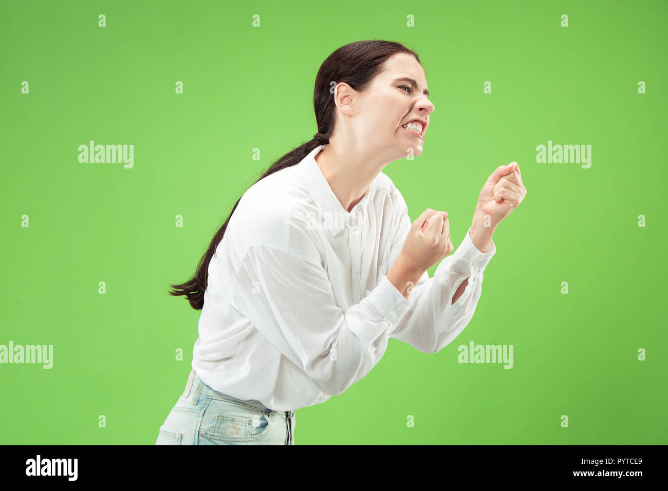 Angry woman looking at camera. Aggressive business woman standing ...