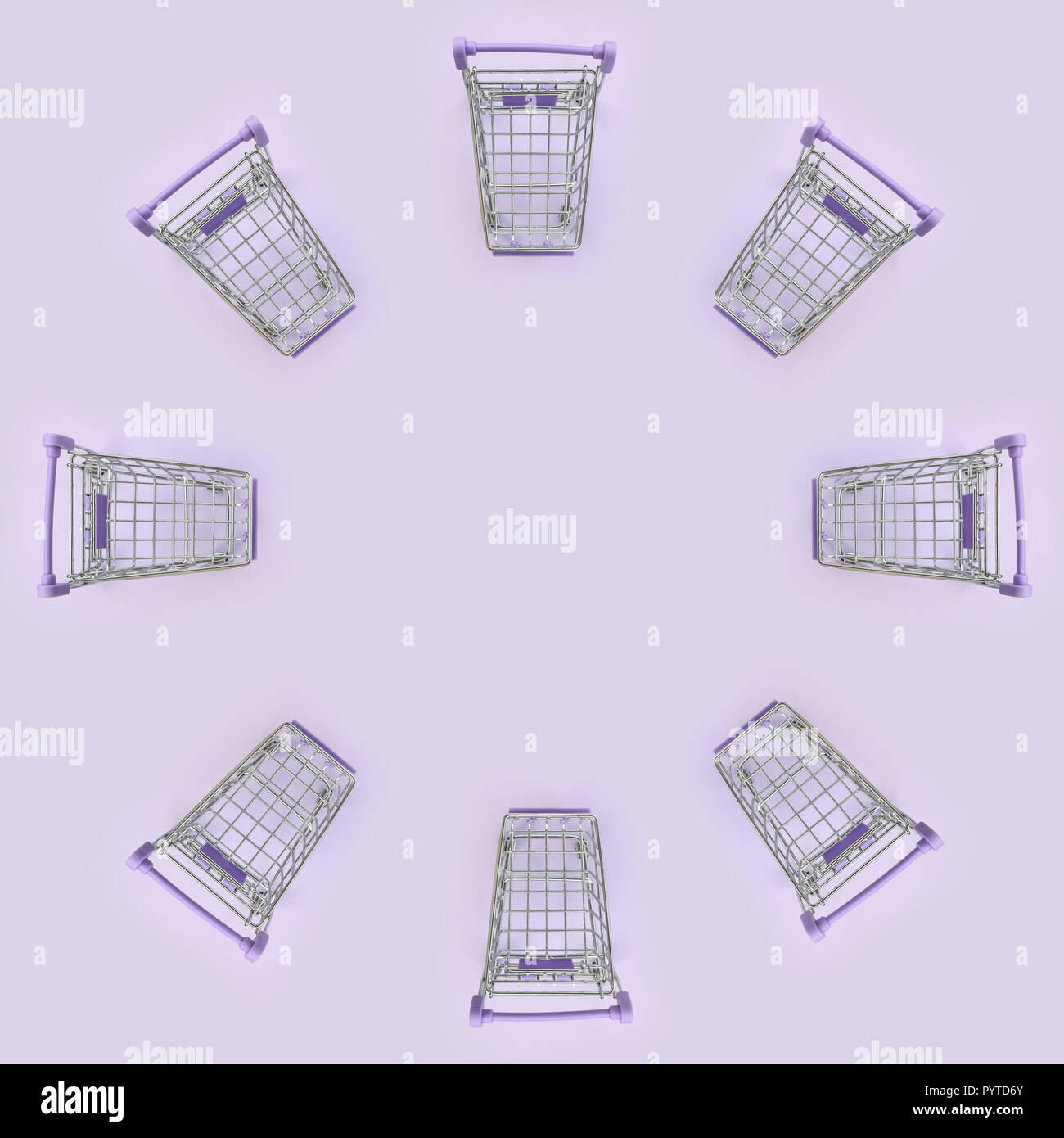 Pattern of many small shopping carts on a violet background. Minimalism ...