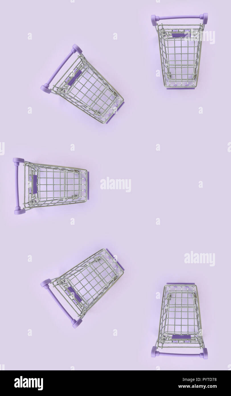Pattern of many small shopping carts on a violet background. Minimalism ...