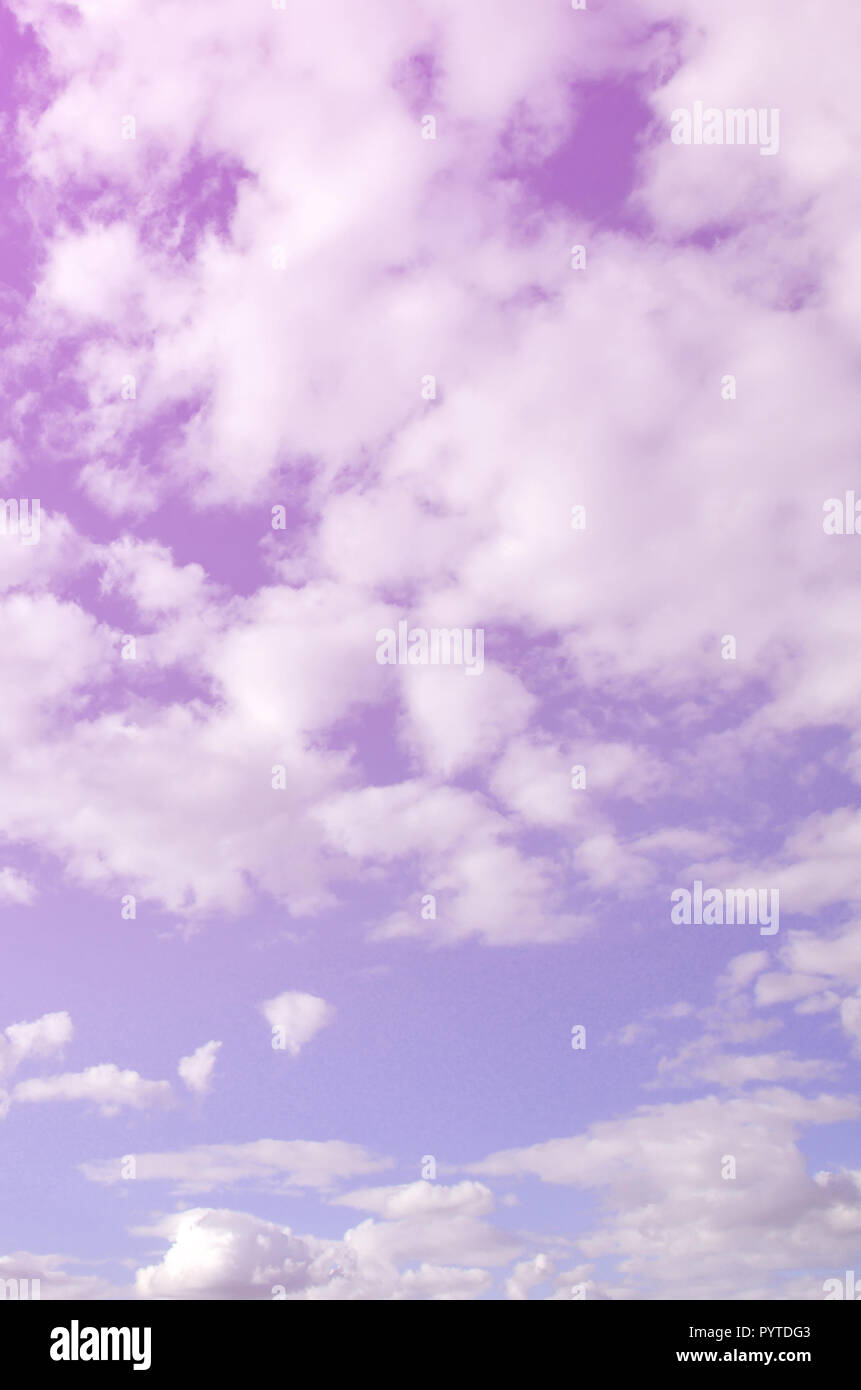 A blue cloudy sky with many small clouds blocking the sun Stock Photo ...