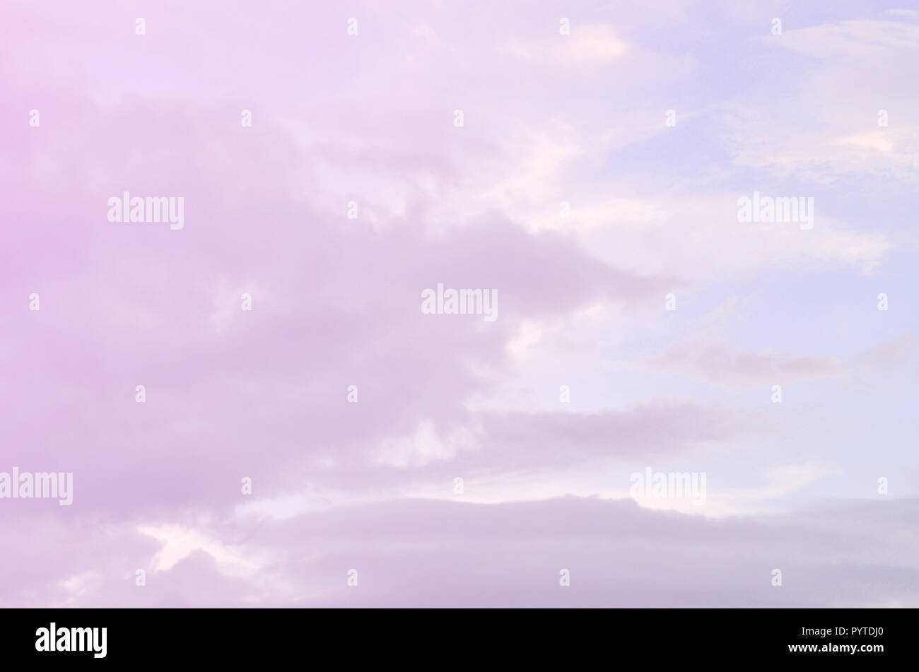 A blue cloudy sky with many small clouds blocking the sun Stock Photo ...