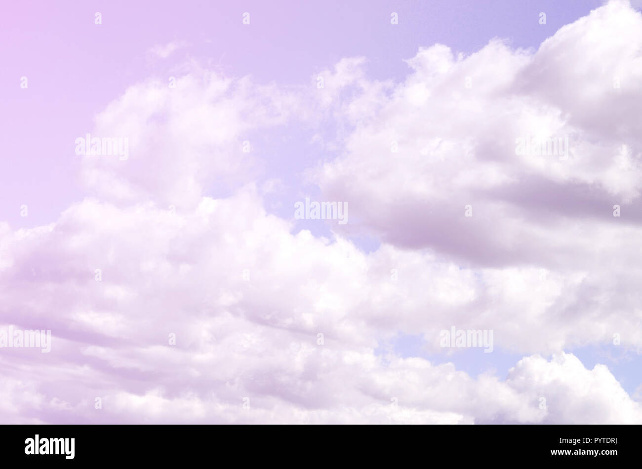 A blue sky with lots of white clouds of different sizes Stock Photo - Alamy