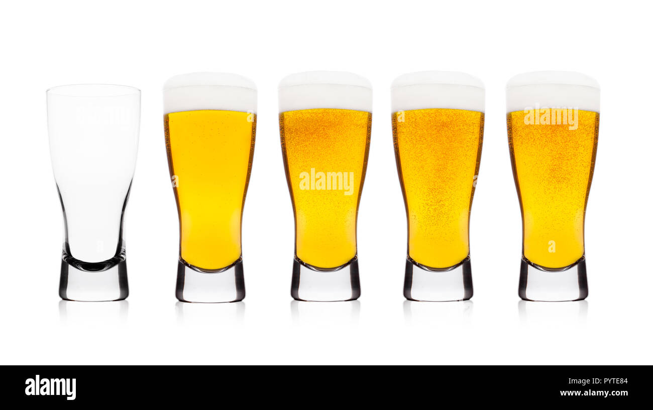 Glasses of lager craft beer with foam and dew on white background Stock ...