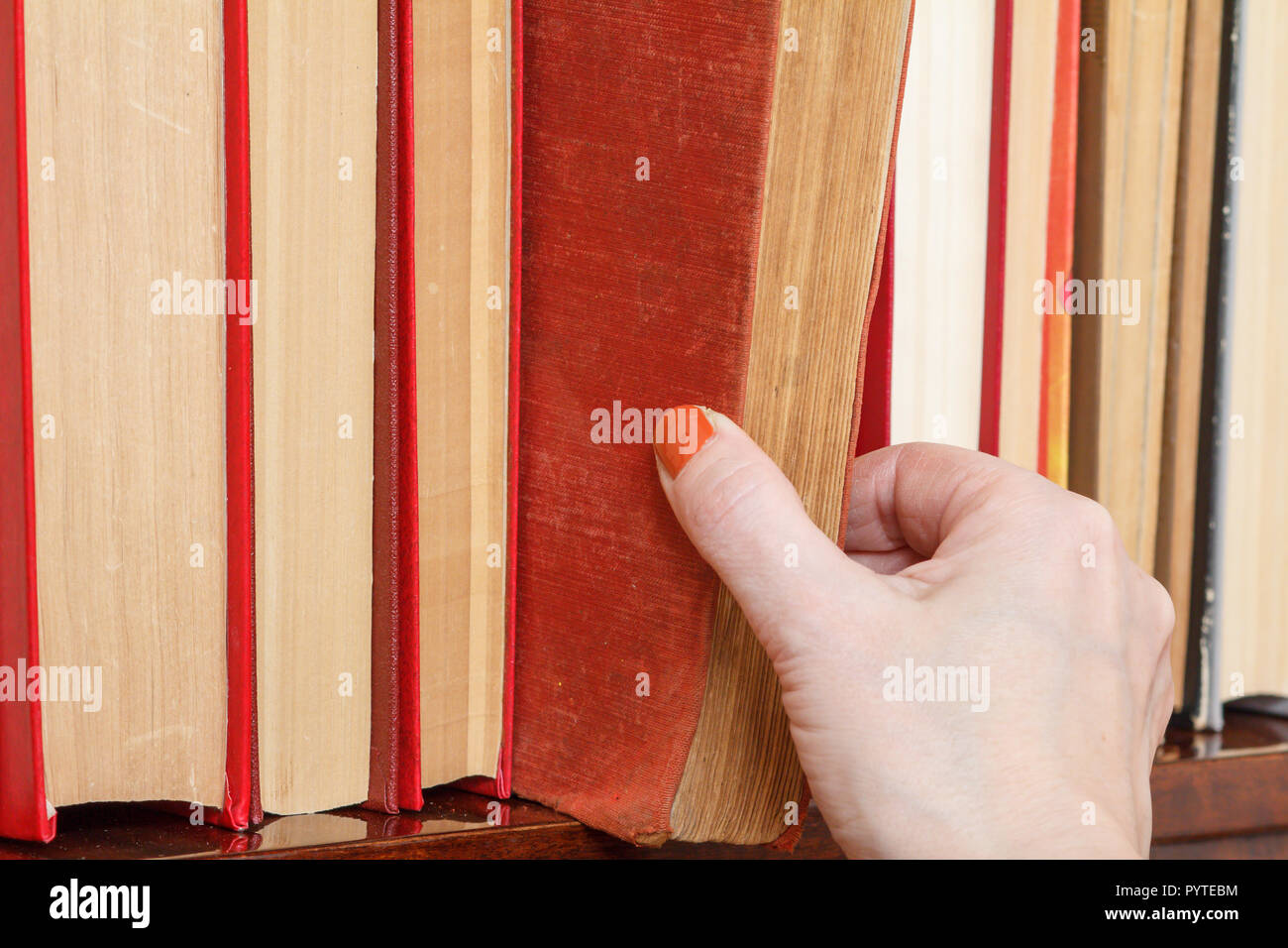 Taking a book hi-res stock photography and images - Alamy