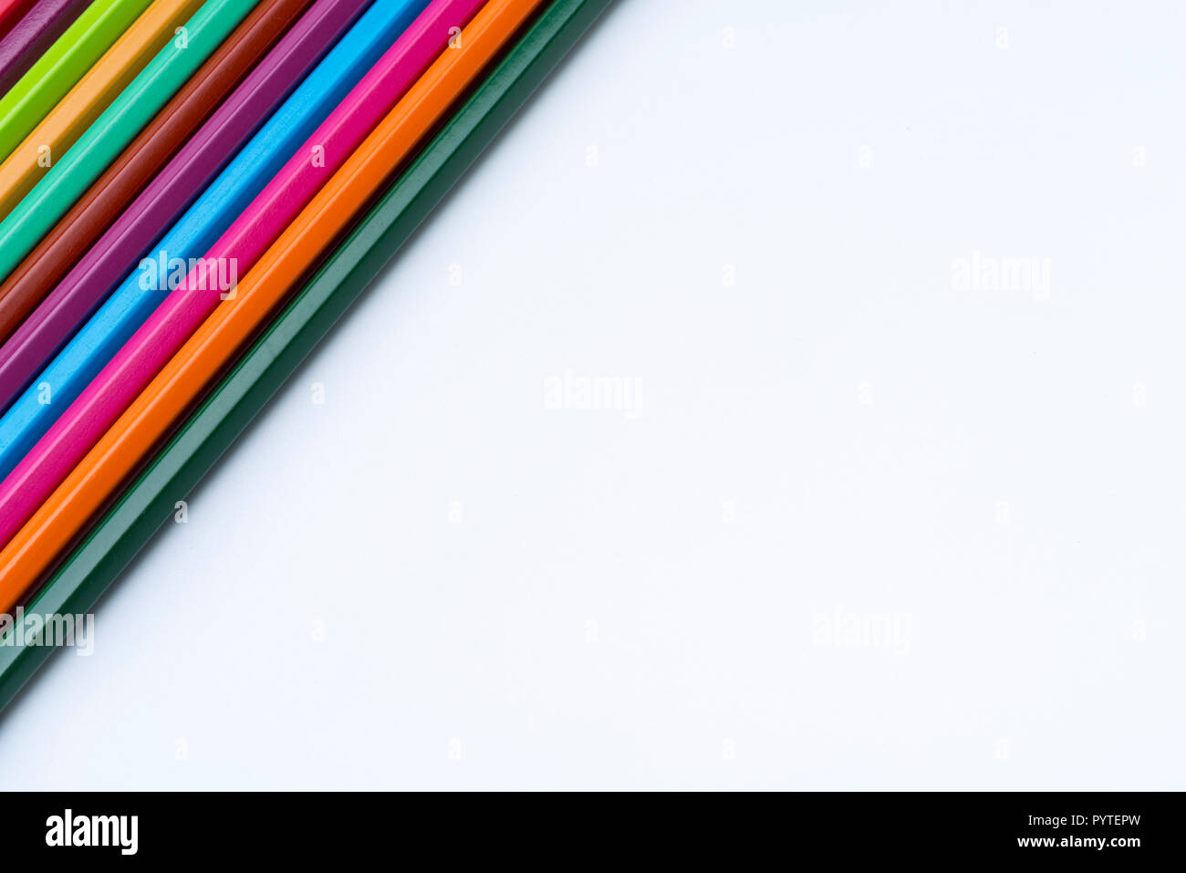 Colored pencils, on a white background close-up in the upper left ...