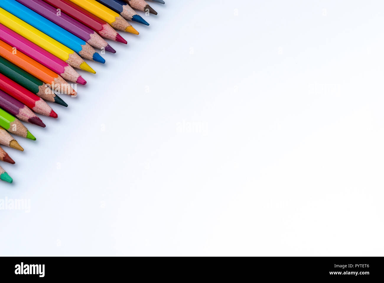 Colored pencils, on a white background close-up in the upper left ...