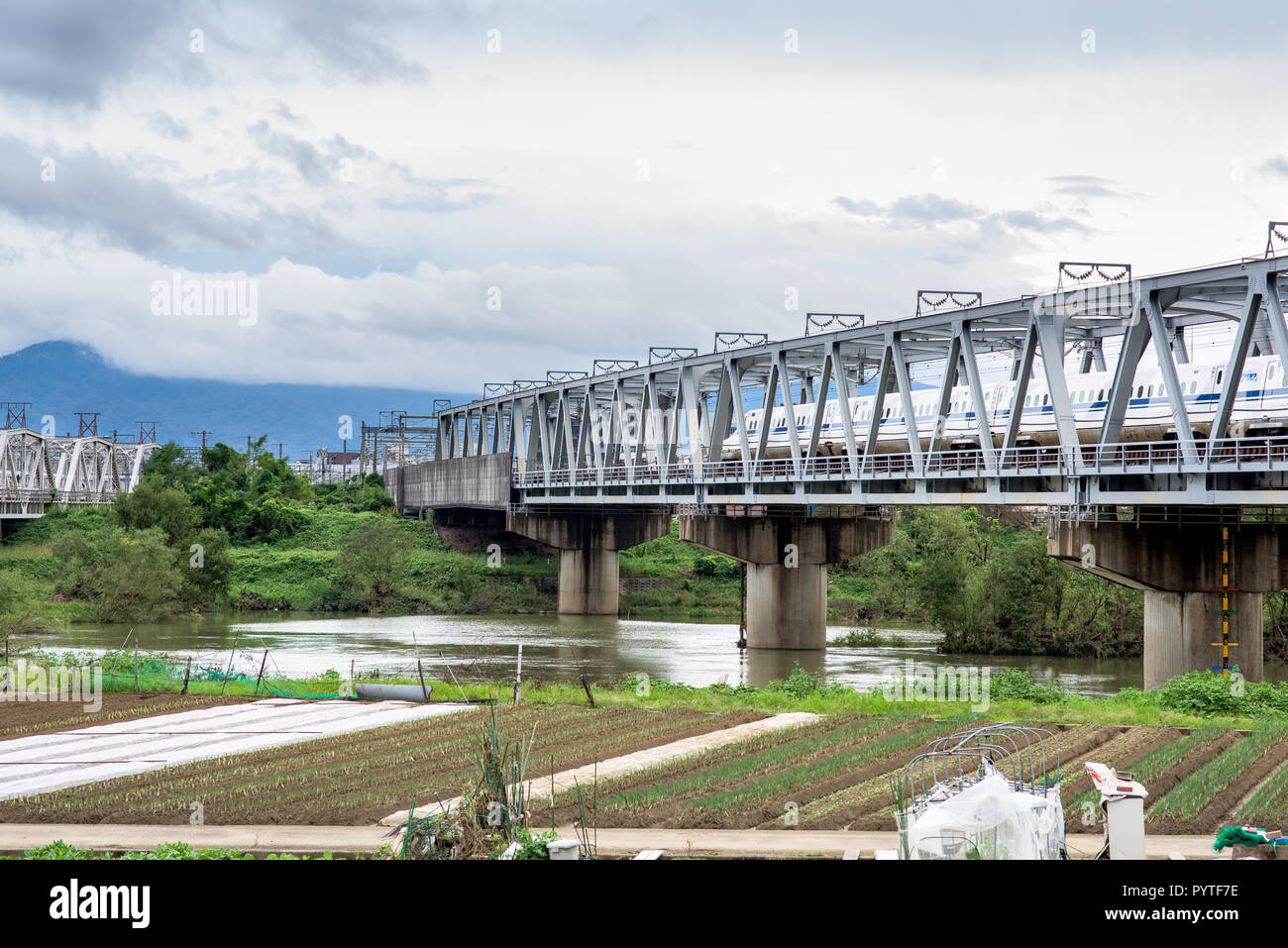 Bridge with shinkansen over Yoshimine river in Kyoto Stock Photo - Alamy
