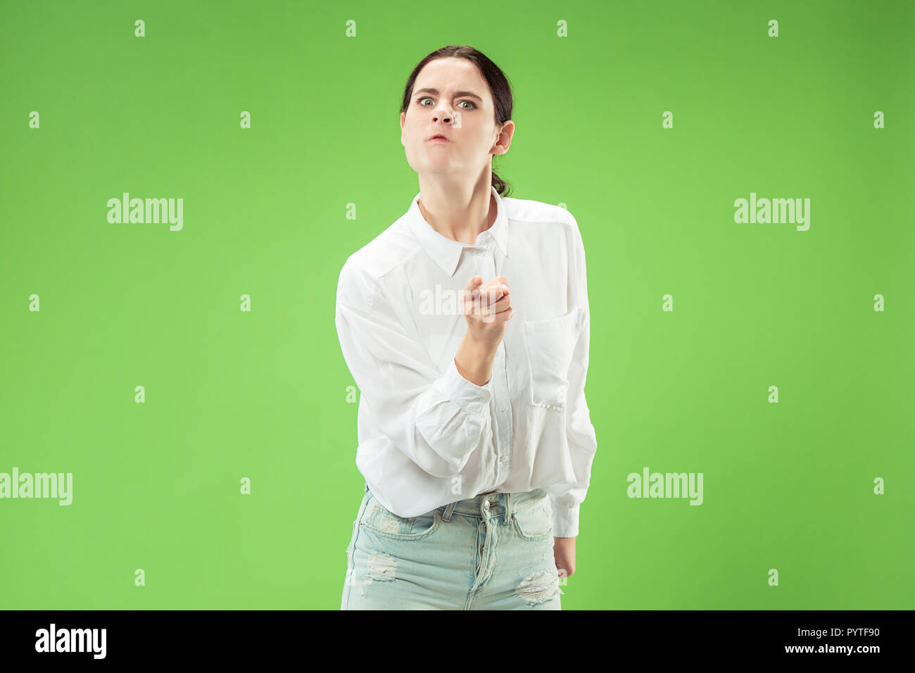 Angry woman looking at camera. Aggressive business woman standing ...