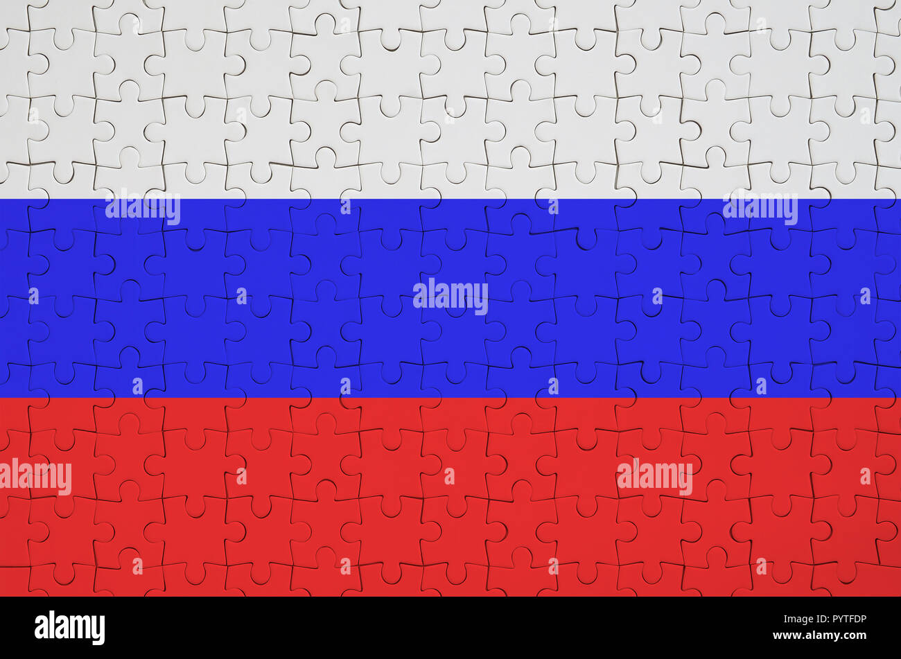 Russia flag is depicted on a folded puzzle Stock Photo - Alamy