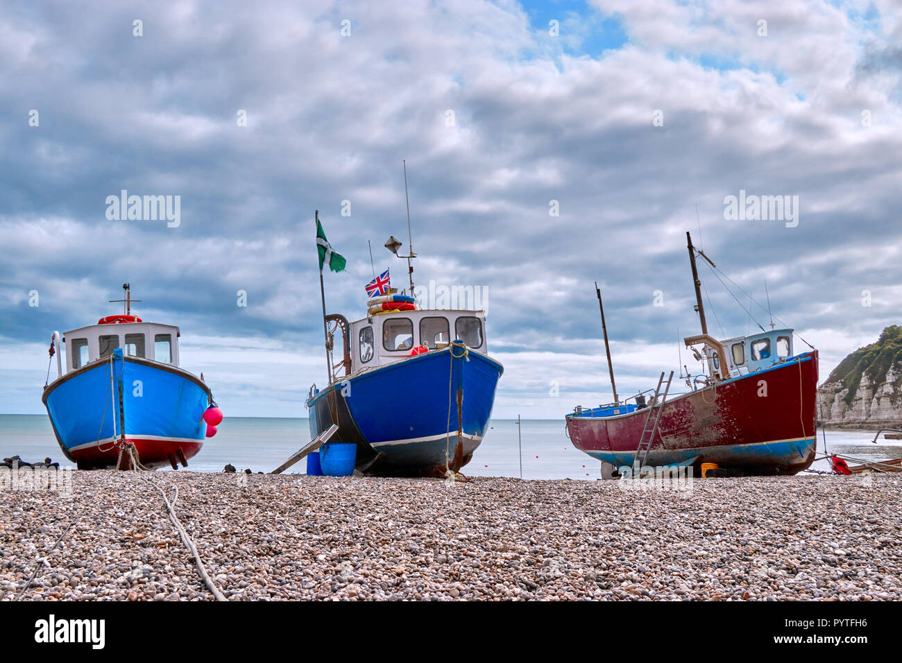 Image of three beached fishing boats on Beer Beach, Devon, England with ...
