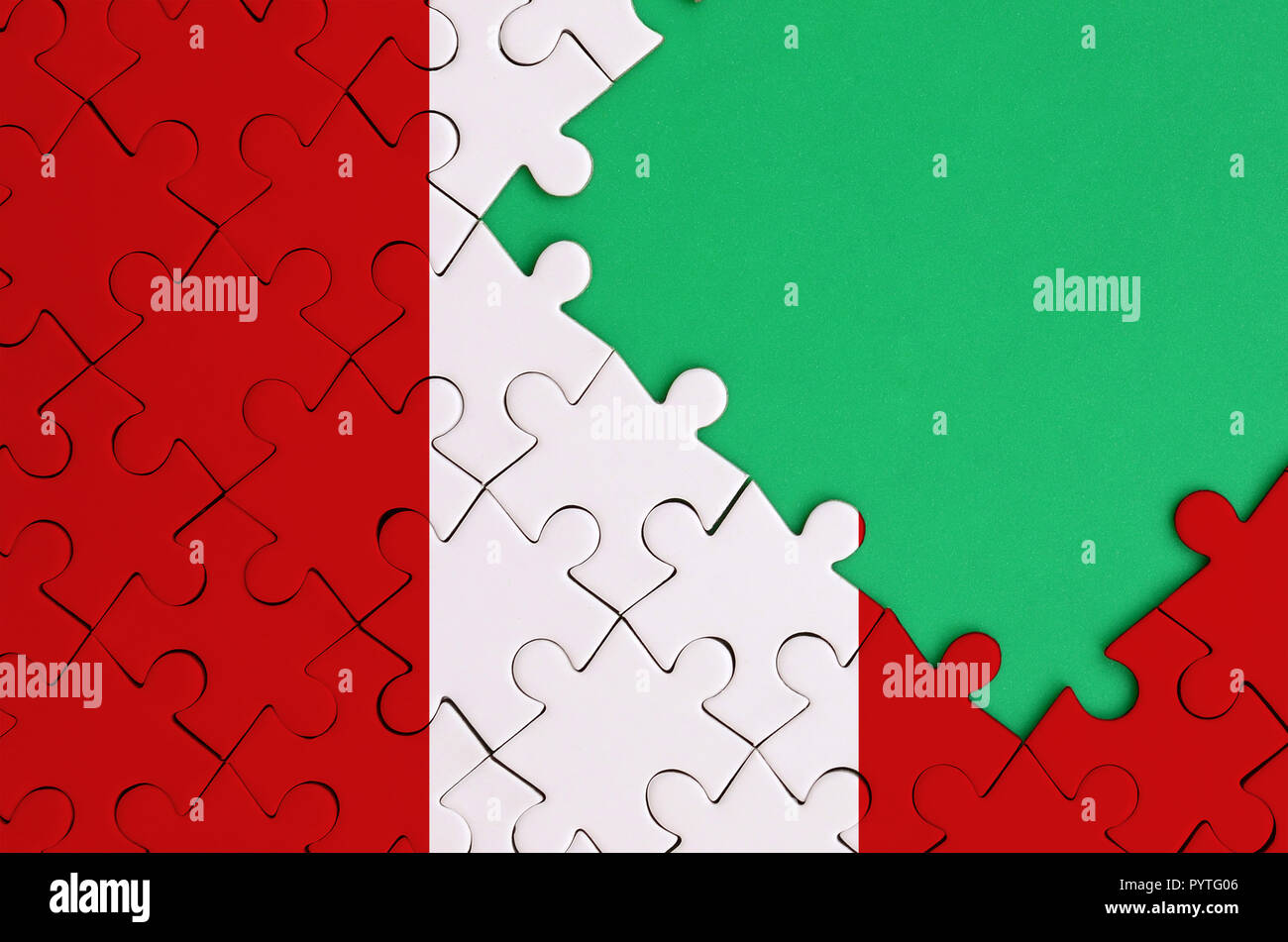 Peru flag is depicted on a completed jigsaw puzzle with free green copy ...