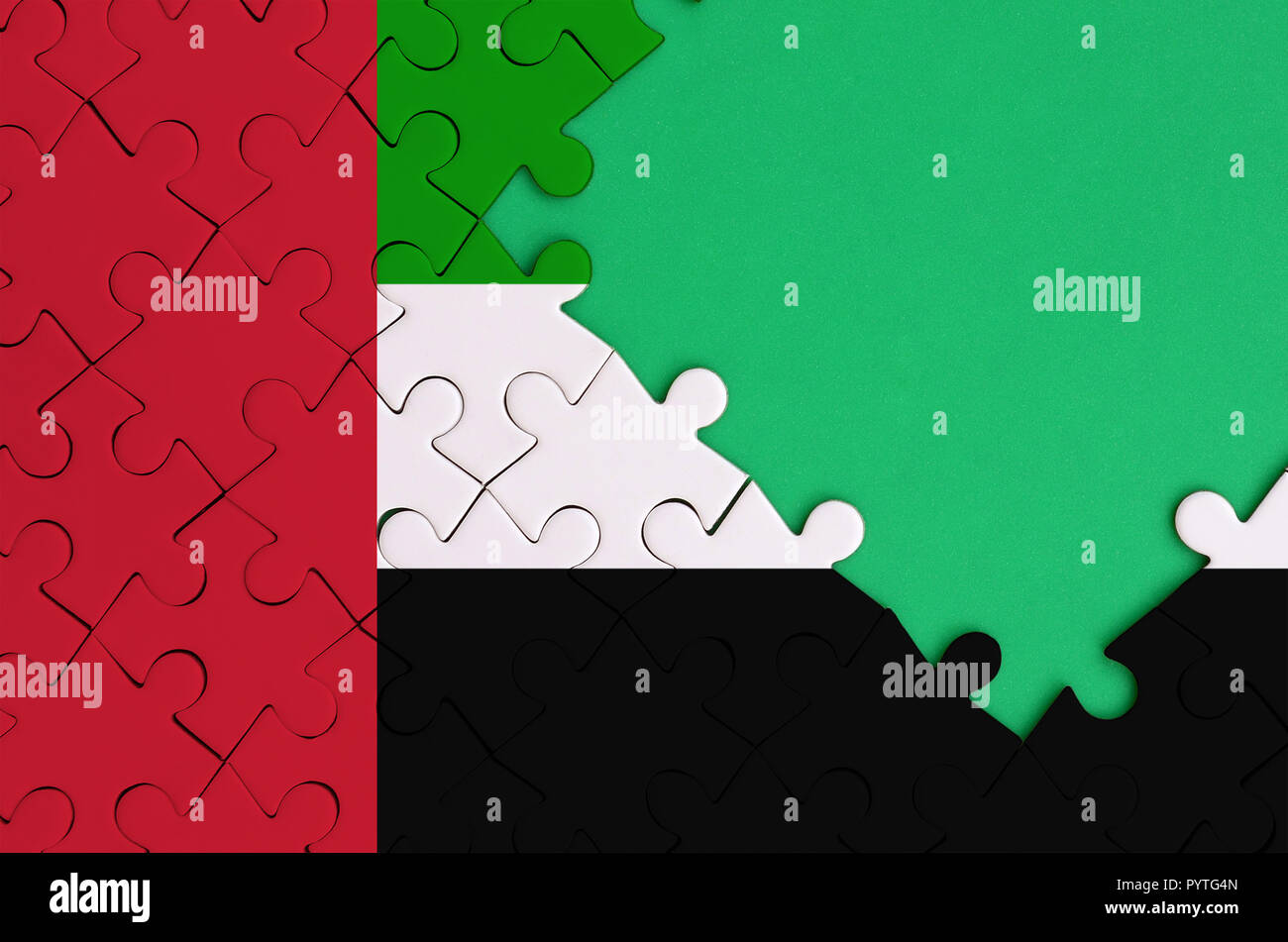 United Arab Emirates flag is depicted on a completed jigsaw puzzle with ...