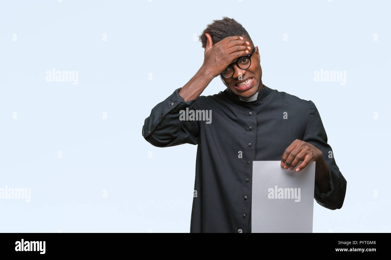 Young african american priest man over isolated background holding ...