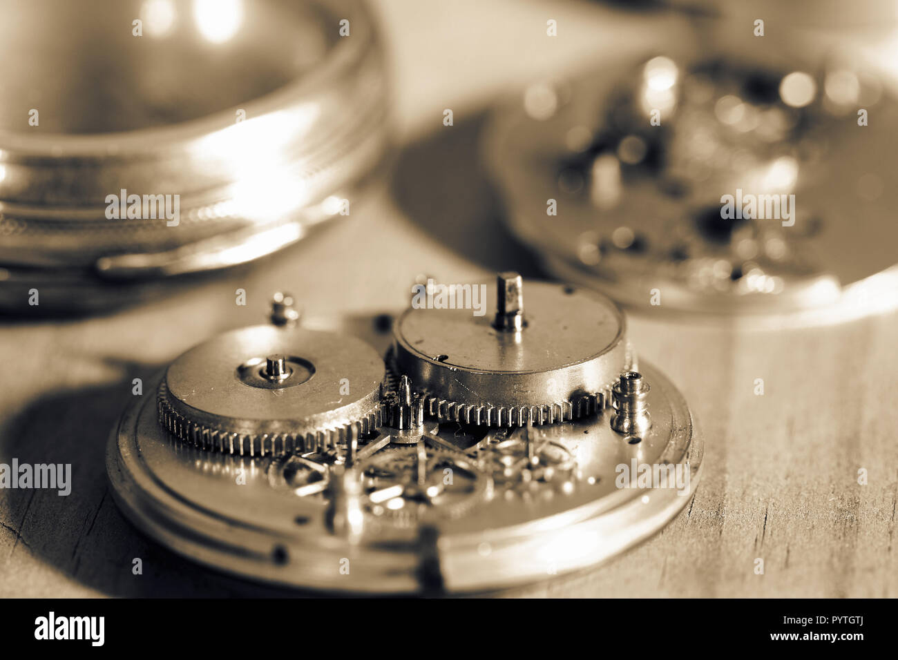 Parts and mechanism from an old antique pocket fob watch on a wood ...
