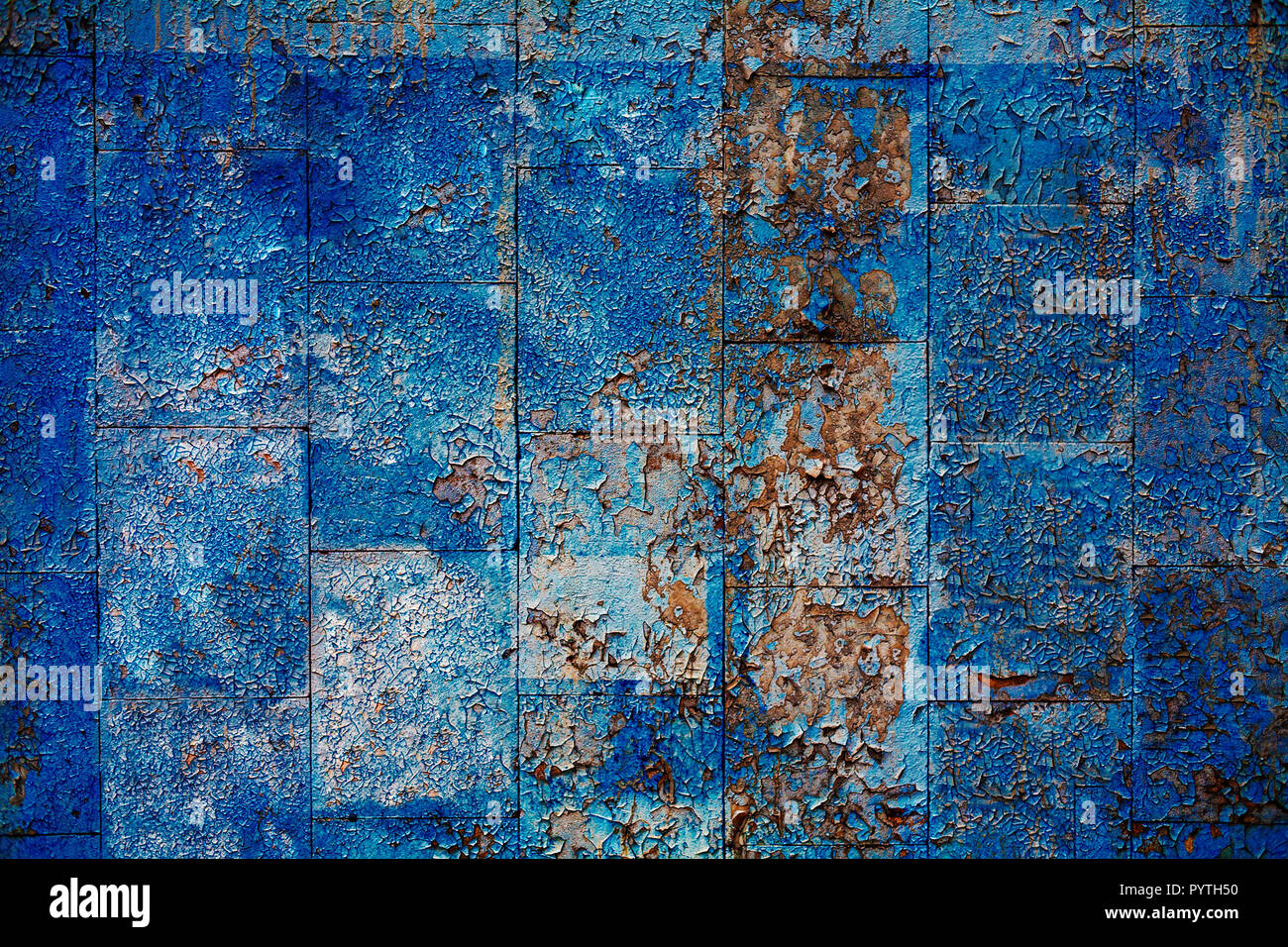 Grungy tiled wall covered with peeleng blue paint, urban decay Stock ...