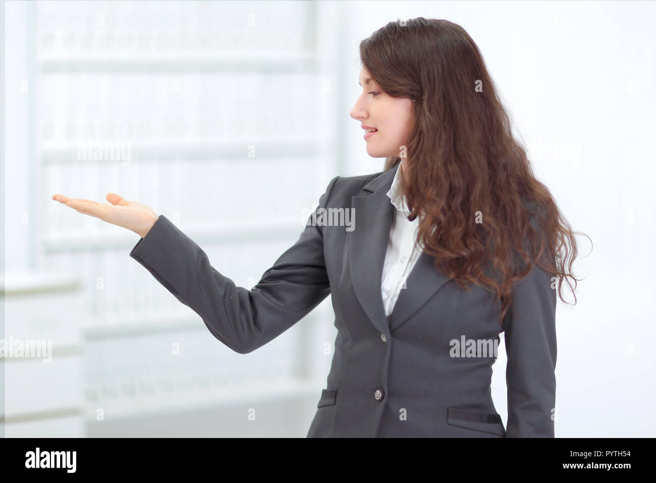 Business people smiling pointing towards hi-res stock photography and ...