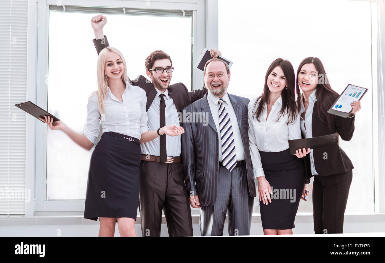boss and happy business team rejoice after signing a lucrative ...