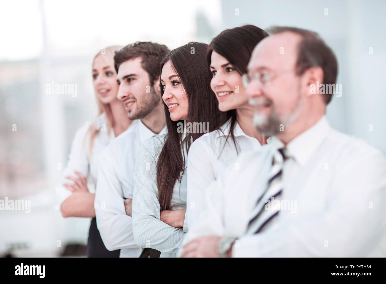 concept of team work - the leader and the business team standing one ...