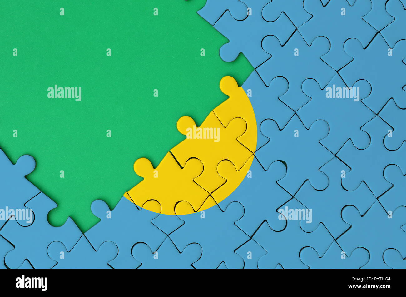 Palau flag is depicted on a completed jigsaw puzzle with free green ...
